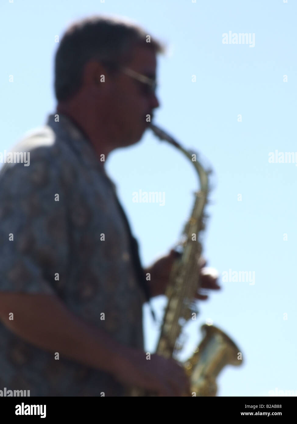 Sax player in the sun hi-res stock photography and images - Alamy