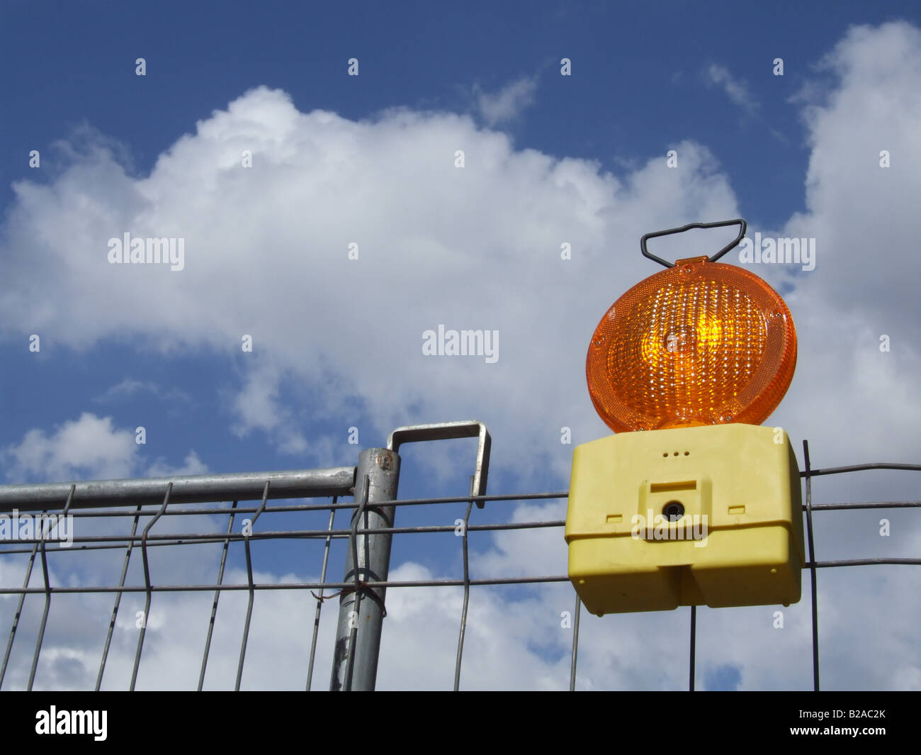hazard safety light on fence by road works Stock Photo - Alamy