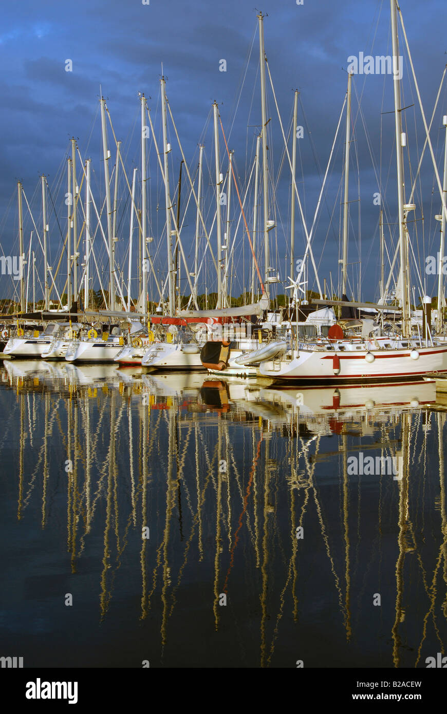 Sailing yachts lying as evening storm clouds gather overhead - Hamble ...