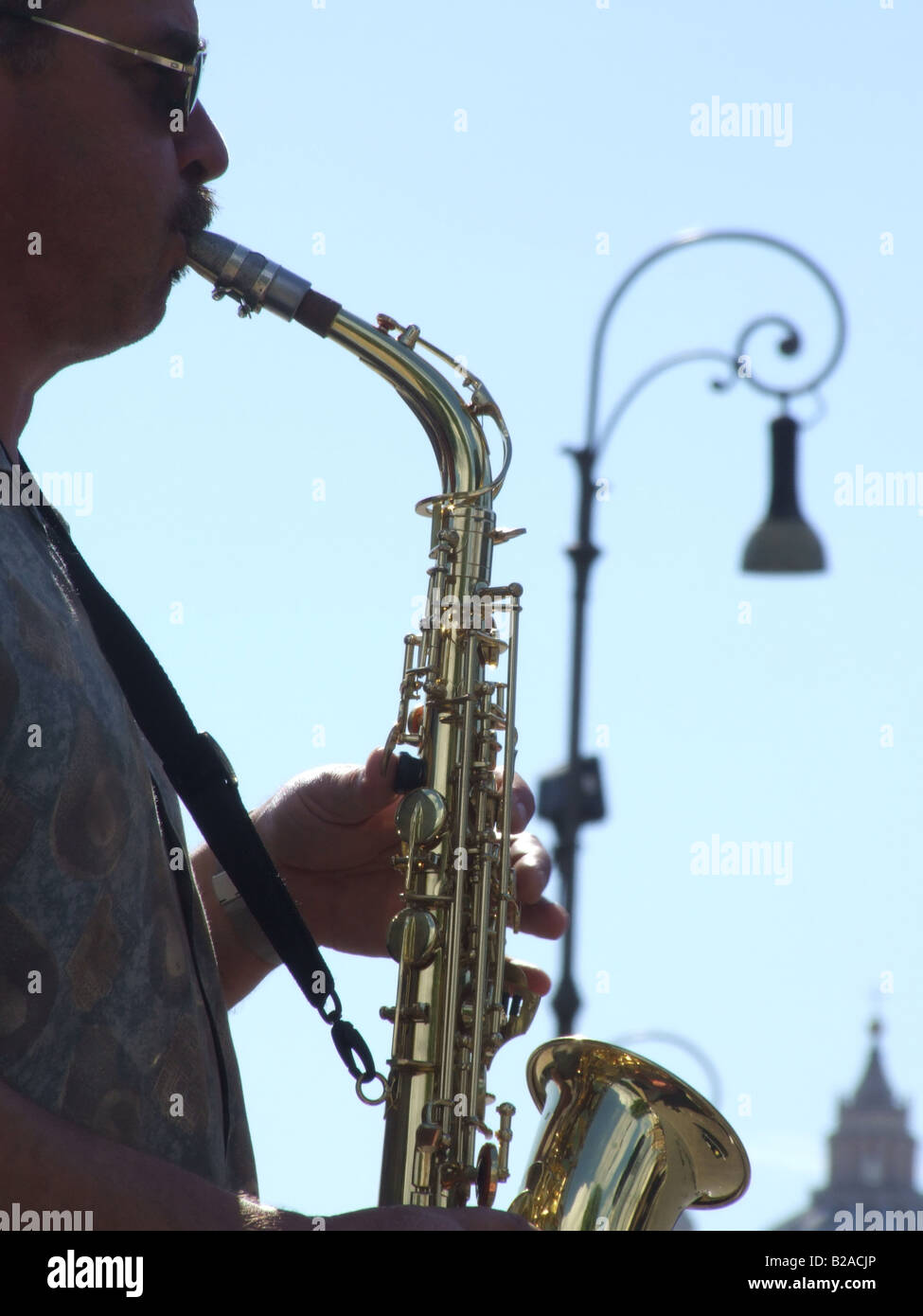 man busker playing saxophone in street in rome Stock Photo - Alamy