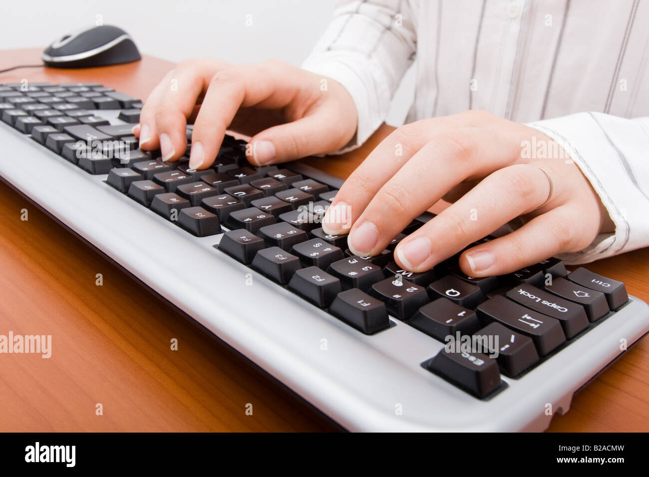 Businesswoman typing in the computer keyboard Stock Photo - Alamy