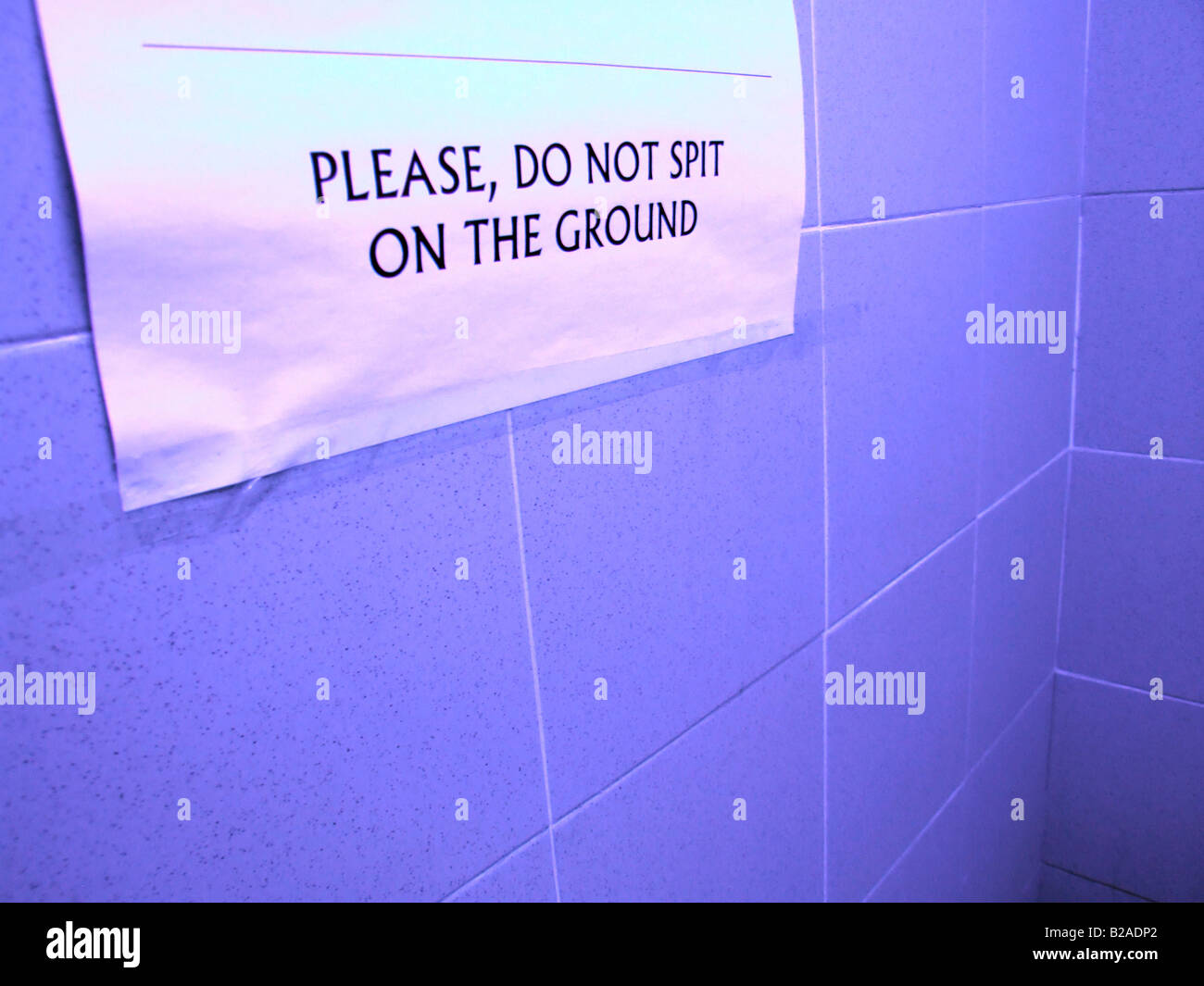 please do not spit on the ground sign in public toilet Stock Photo - Alamy