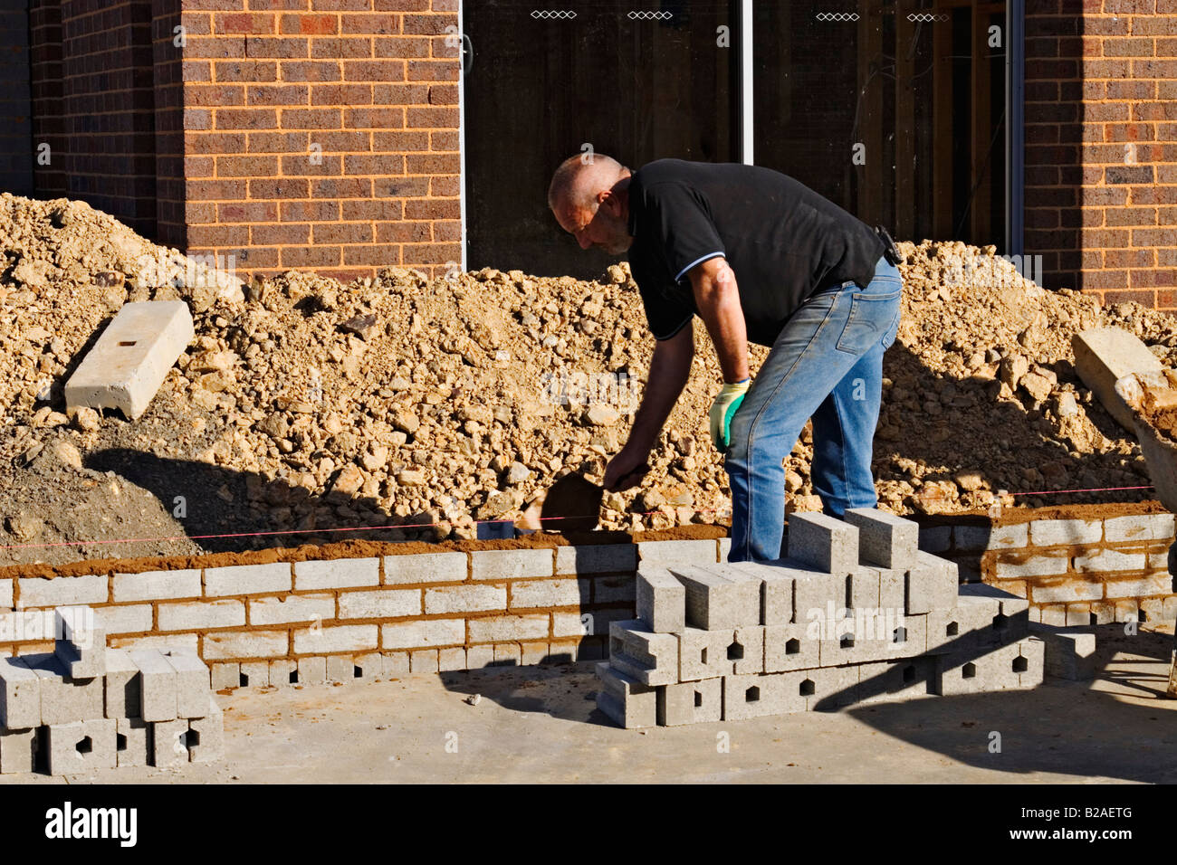 Building Industry / Residential construction.A Bricklayer at work on a ...
