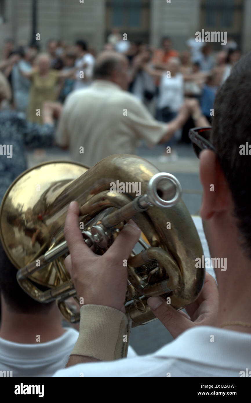 Man with a 'fiscorn' and people dancing the 'sardana' in the street in ...