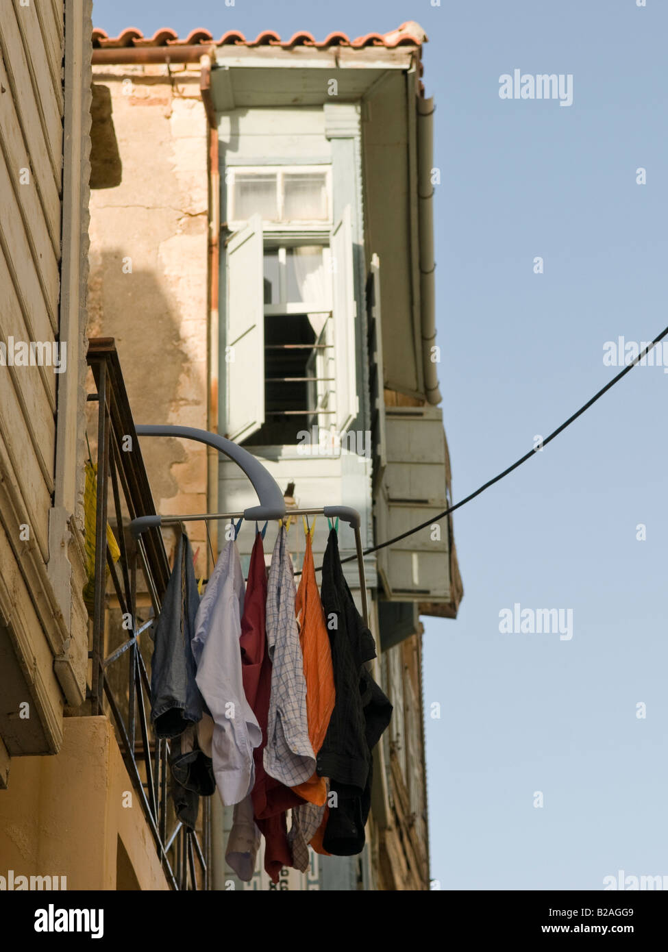 Washing hanging out to dry on a Mediterranean balcony Stock Photo - Alamy