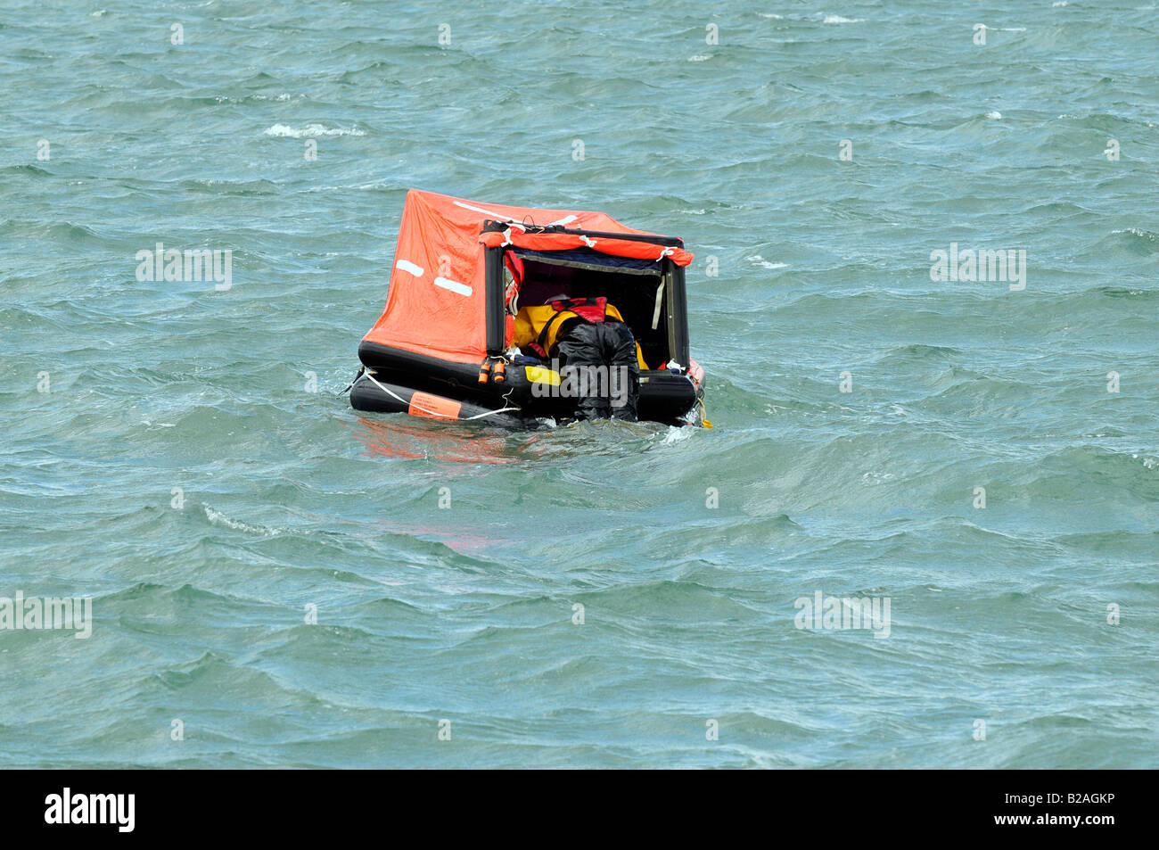 RNLI Crew members aboard an inflatable liferaft during a rescue ...