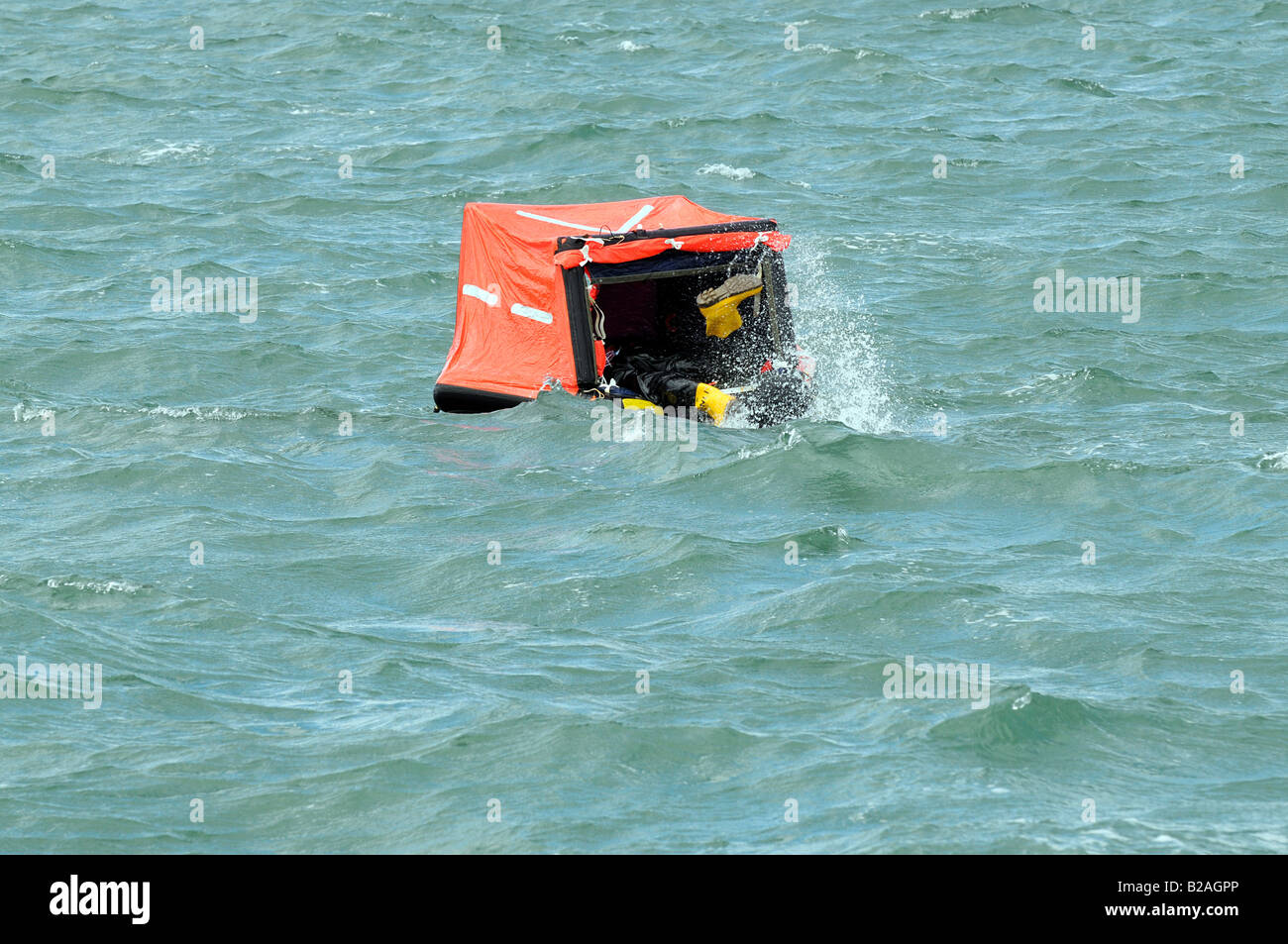 RNLI Crew members aboard an inflatable liferaft during a rescue ...
