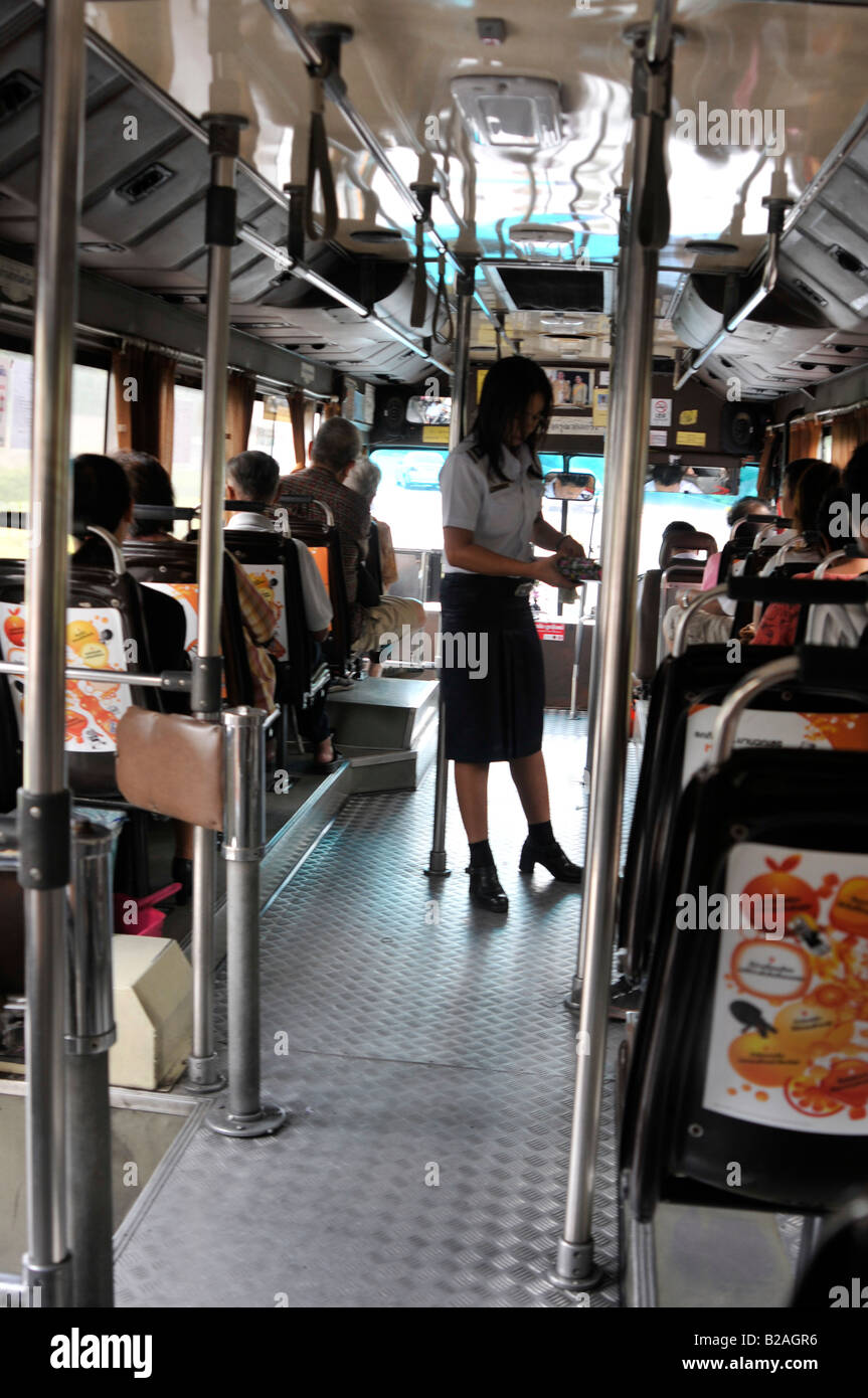 nice looking ticket inspector in high heels,bus ride, bangkok ...