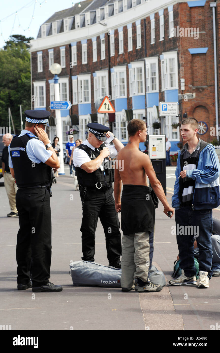 English Police officers questioning youths in relation to carrying ...