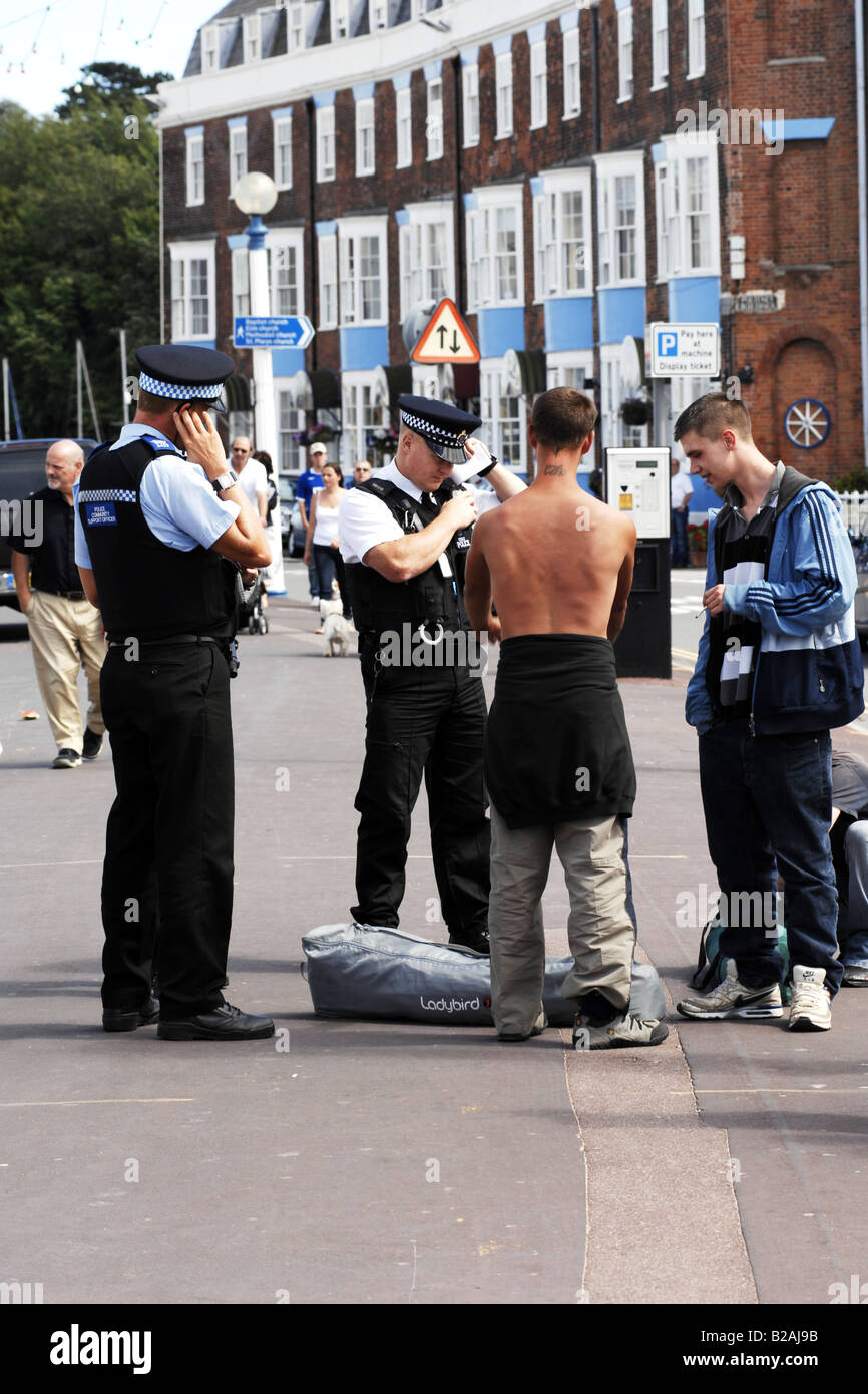 English Police officers questioning youths in relation to carrying ...