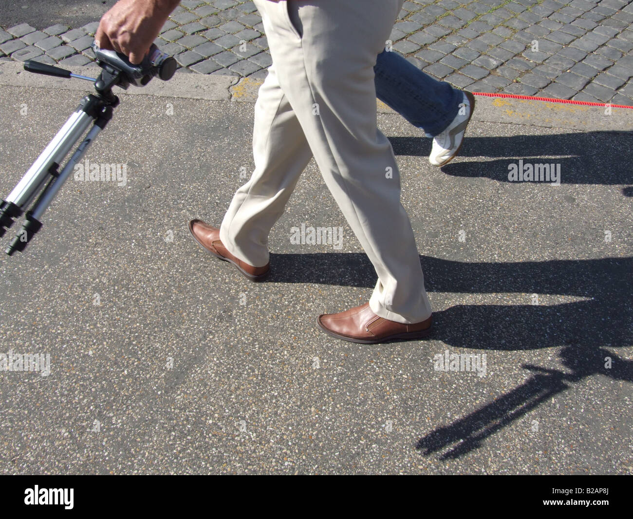 one person walking in street in city town Stock Photo - Alamy