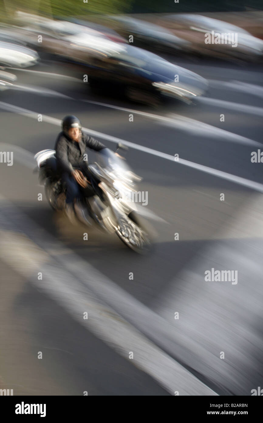 fast speed motorbike on busy street in town Stock Photo - Alamy