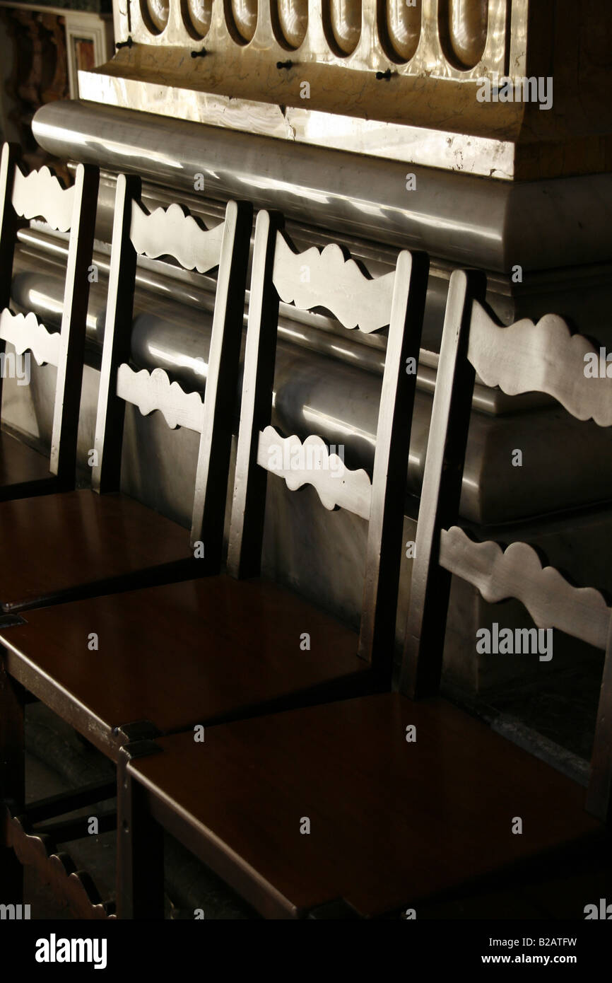 row empty wooden chairs in church, rome, italy Stock Photo - Alamy