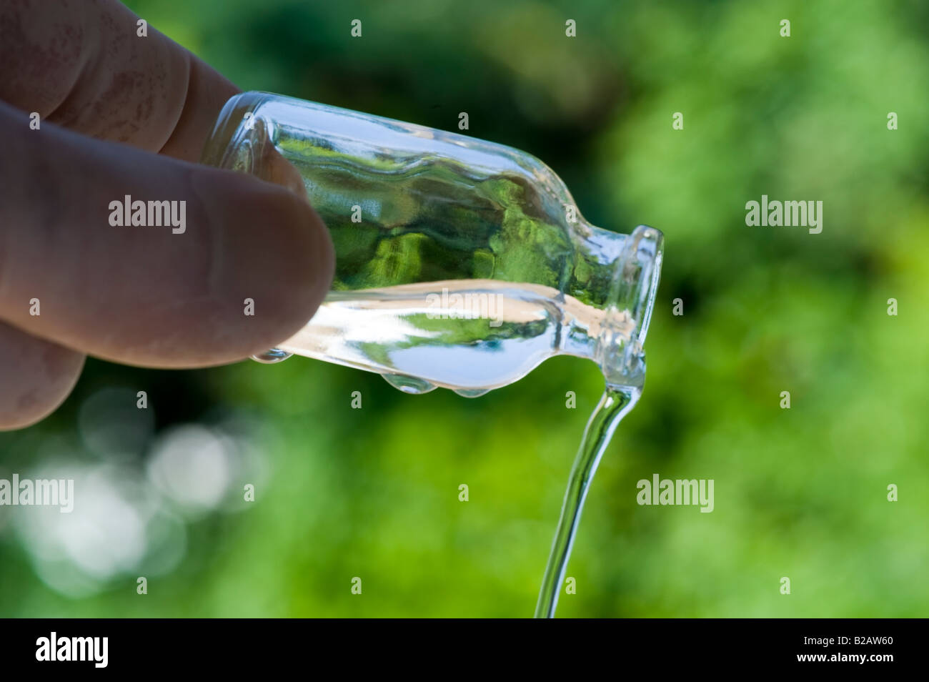 hand holding small vial outdoors Stock Photo - Alamy