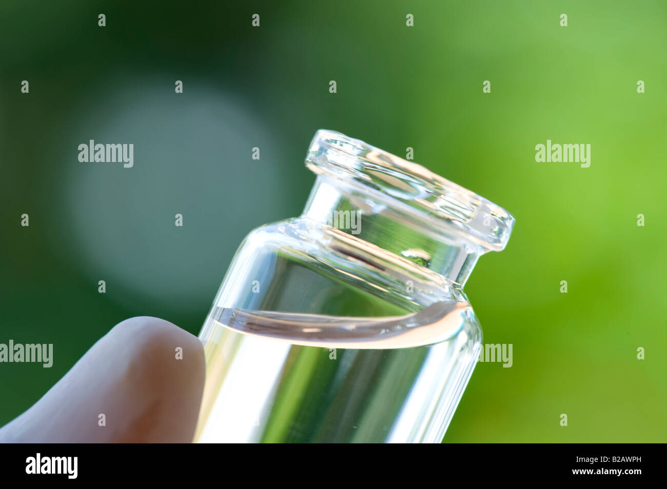 hand holding small vial outdoors Stock Photo - Alamy