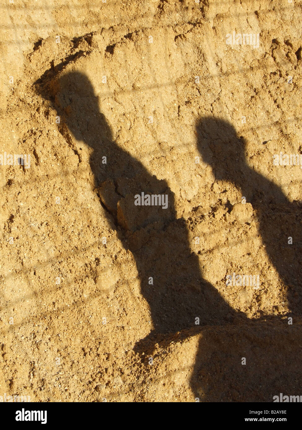 people's shadow on sand pit in building site Stock Photo - Alamy