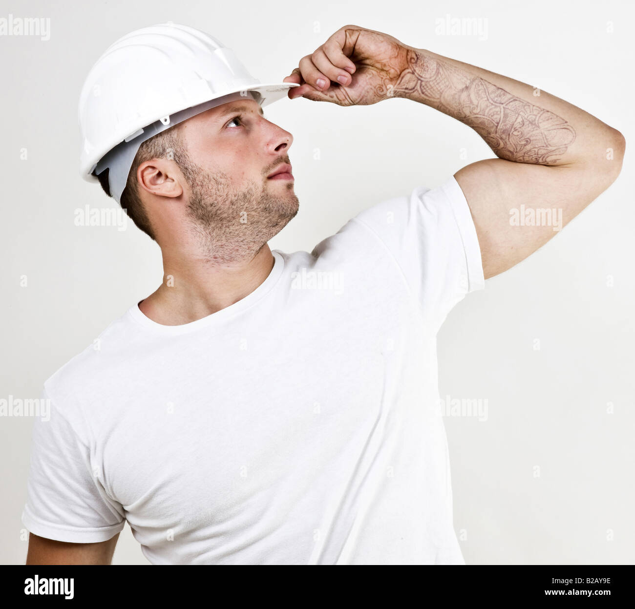 engineer with hard hat on isolated background Stock Photo - Alamy