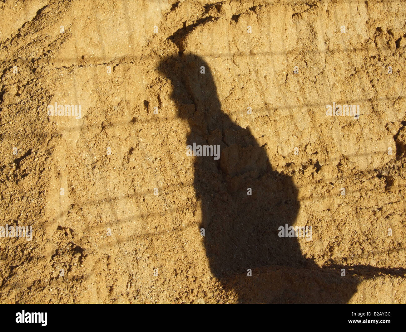 Sinister shadow on sand hi-res stock photography and images - Alamy