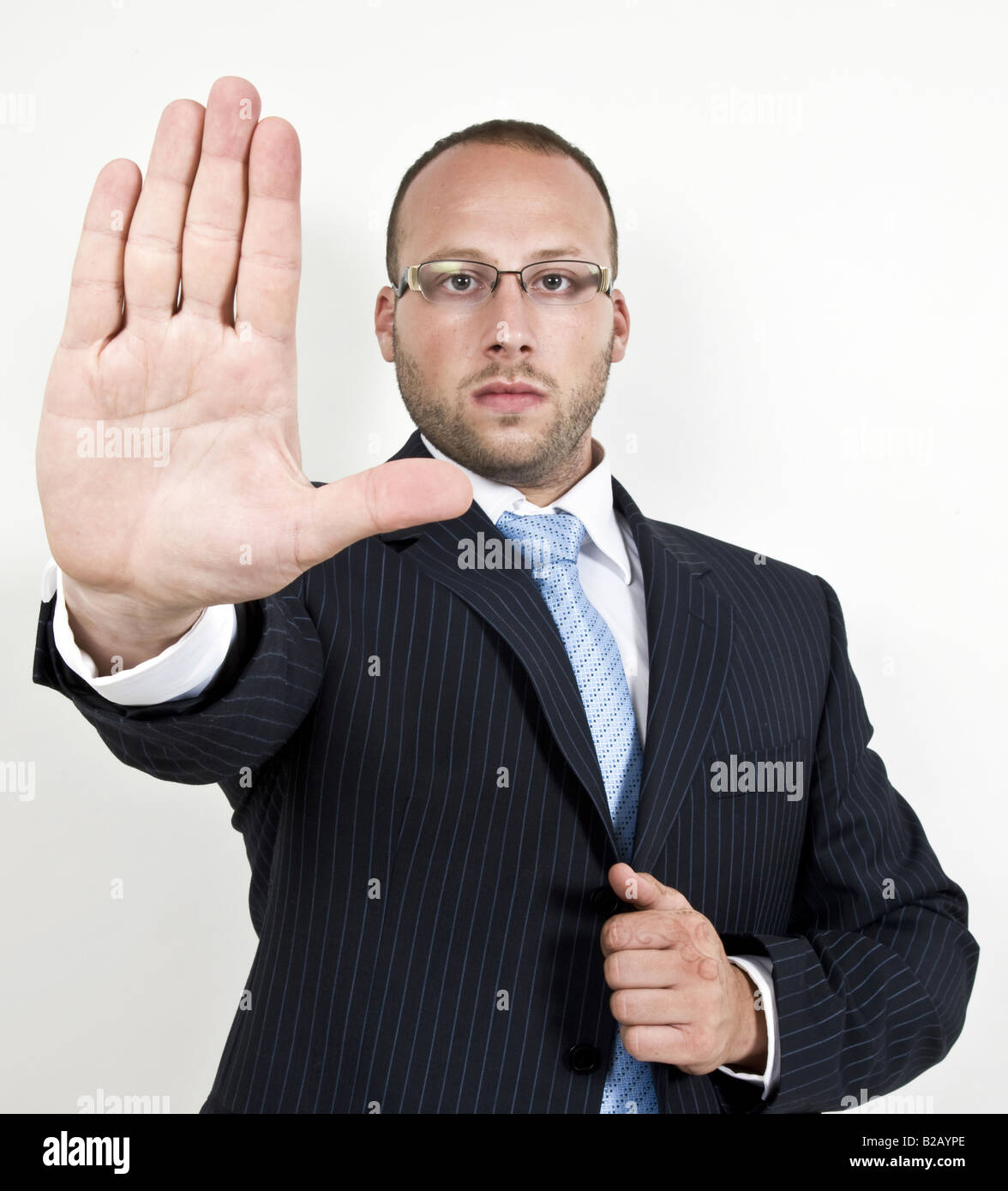 stopping businessman holding his hand up in a halt gesture Stock Photo ...