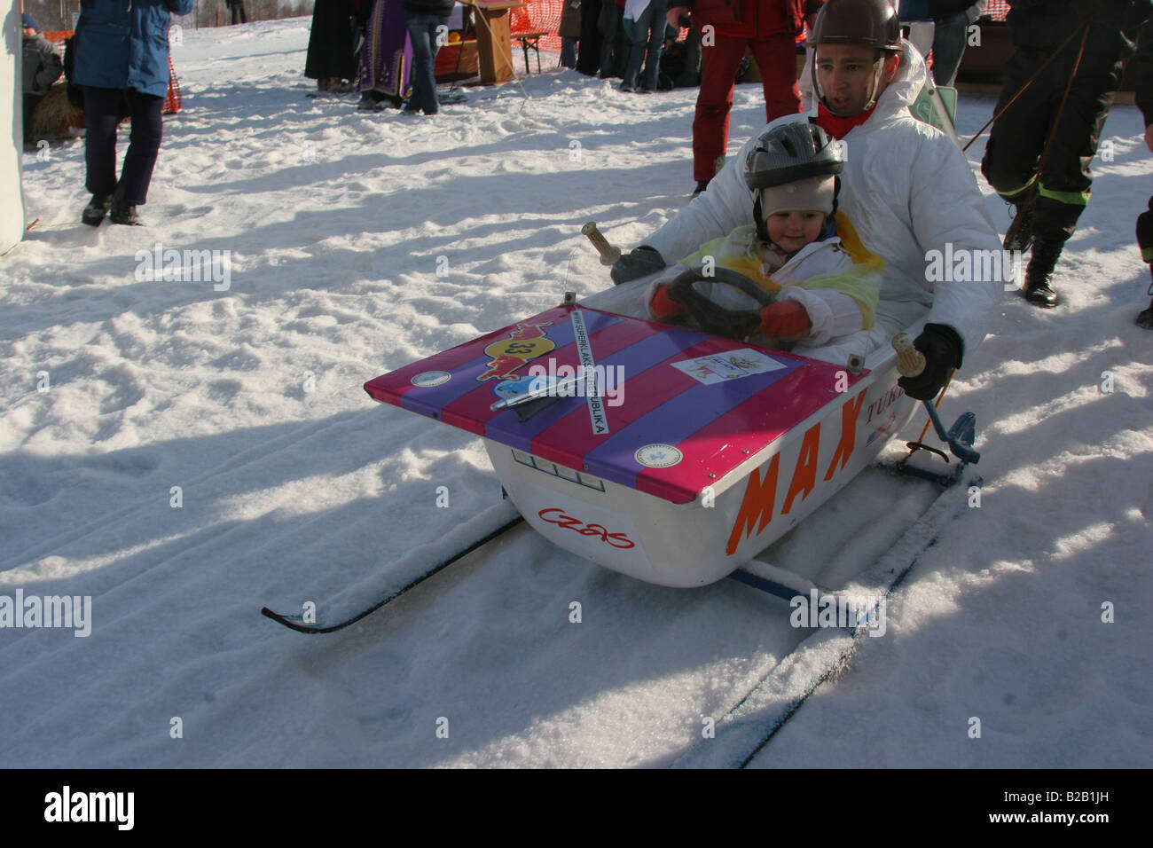 Fun on sledges Stock Photo - Alamy
