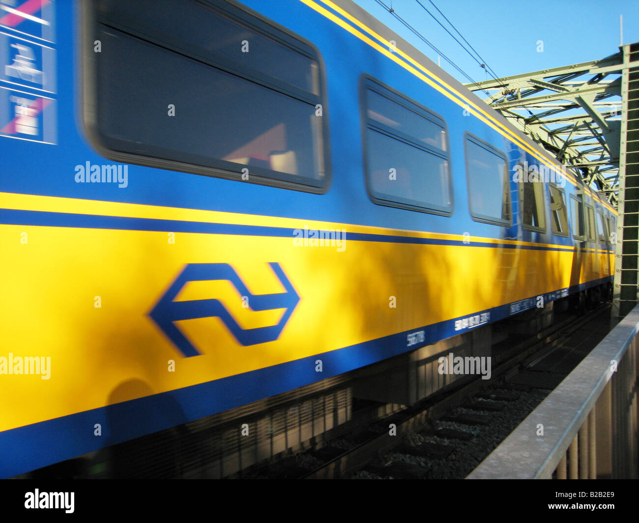 Dutch train passing with Dutch rail logo visible Stock Photo - Alamy