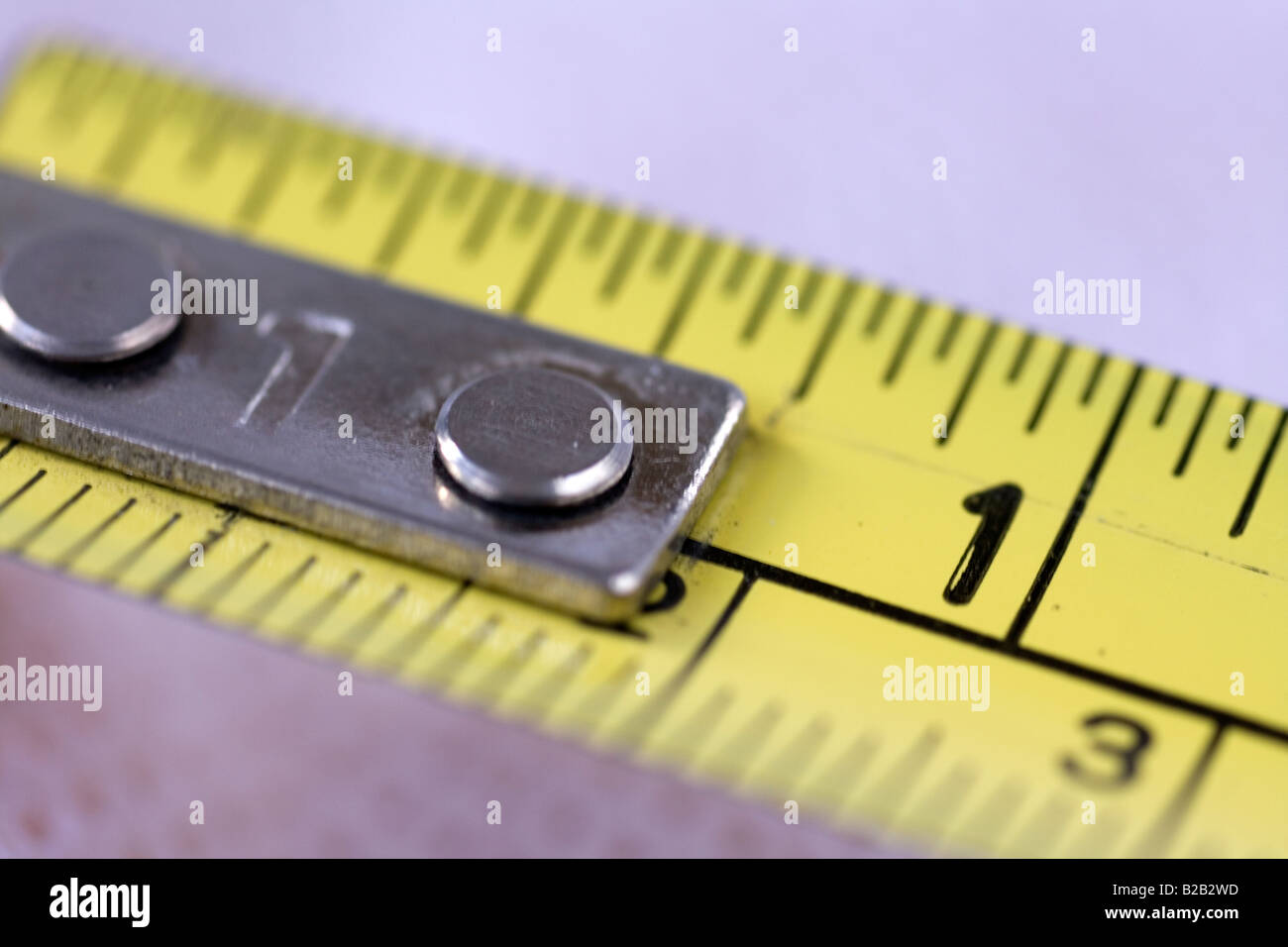 Close up of a metal tape measure Stock Photo - Alamy