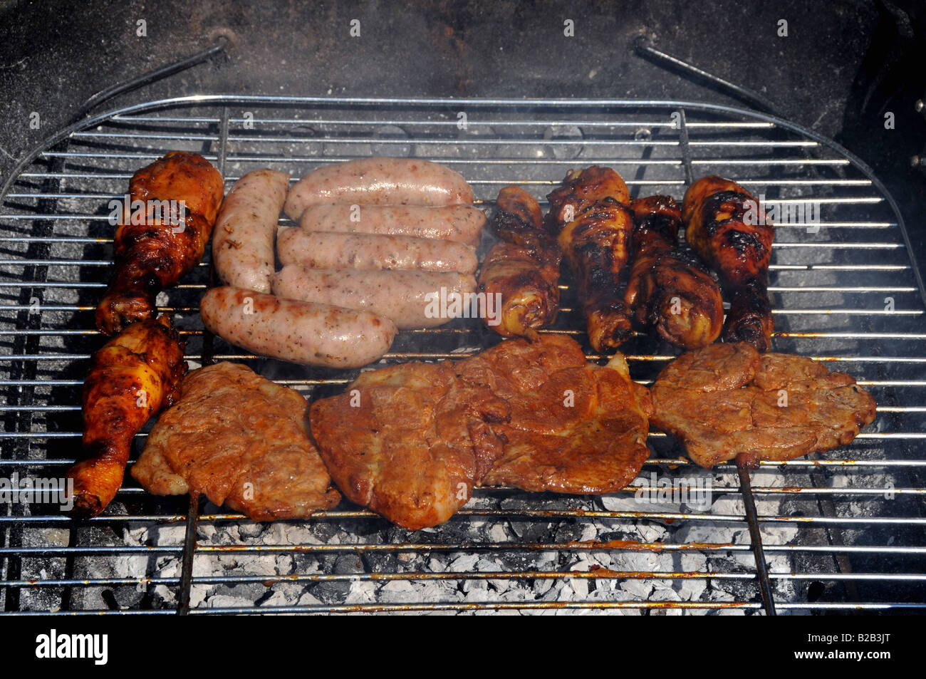 Cooking meat on a grill hi-res stock photography and images - Alamy