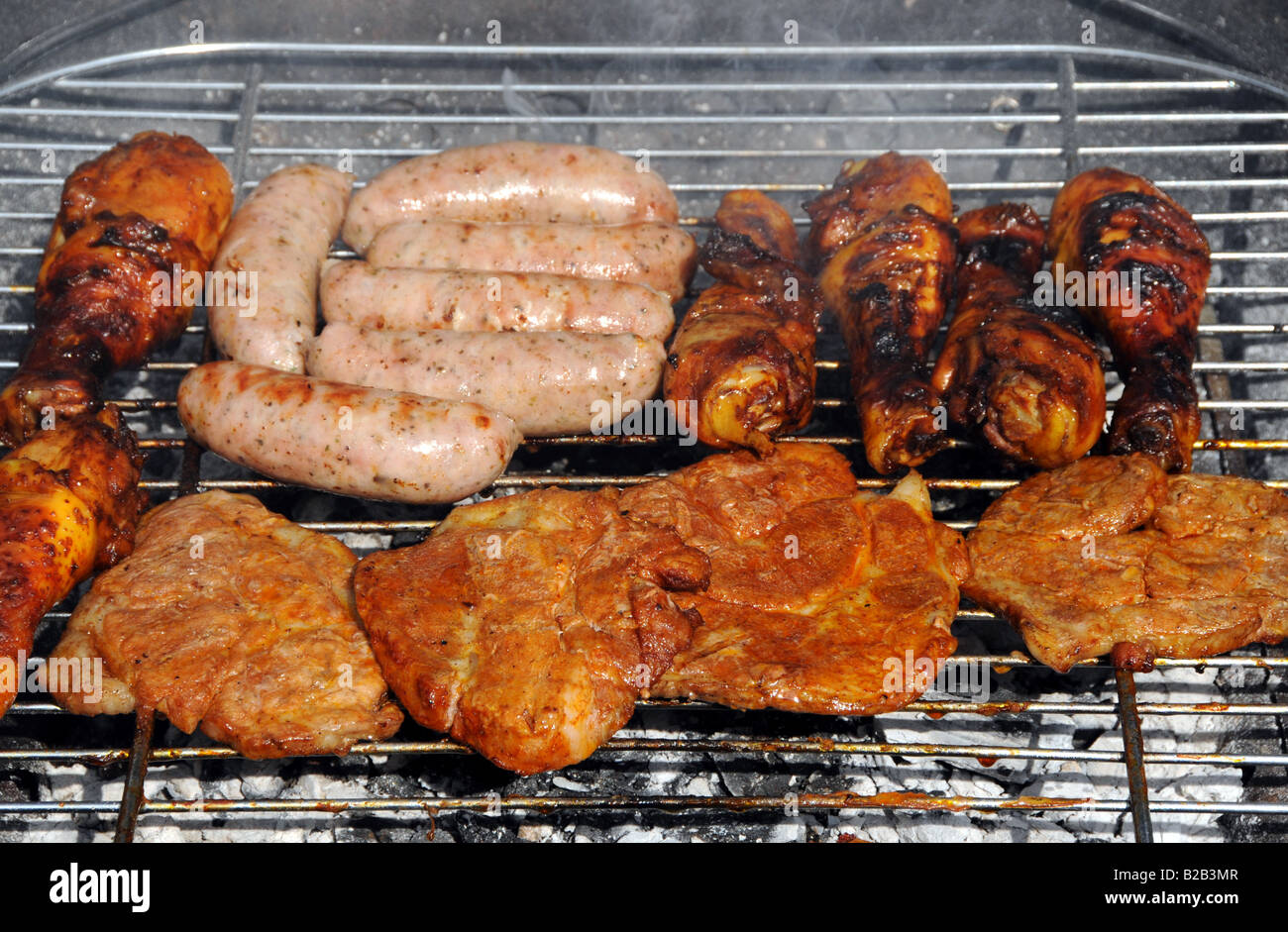 Meat cooking on a BBQ Stock Photo - Alamy