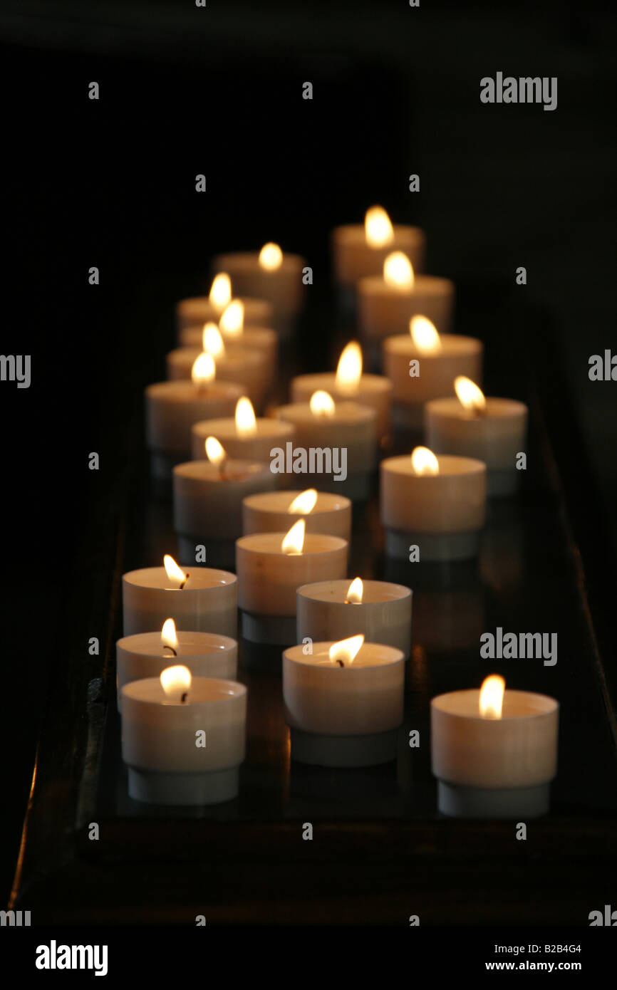 many lit candles in dark room in church Stock Photo - Alamy