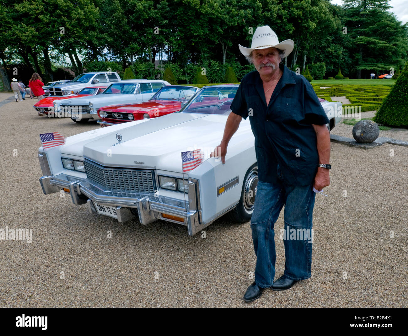 Proud owner of Cadillac at American car show in the park of Chateau ...