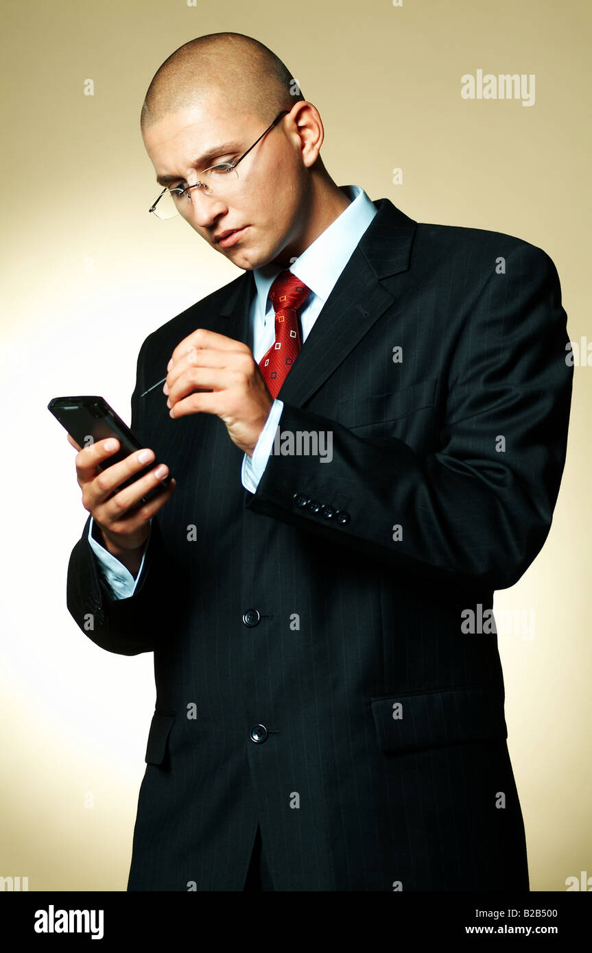 A businessman using PDA computer Stock Photo - Alamy