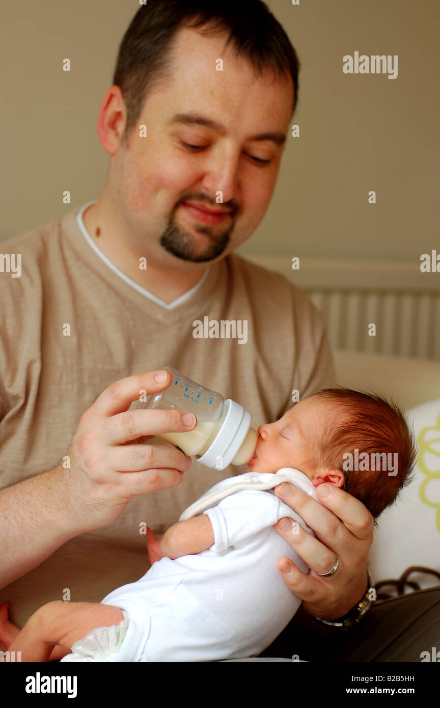 Father feeding new born baby hi-res stock photography and images - Alamy