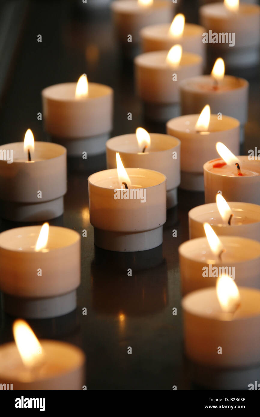 many lit candles in dark room in church Stock Photo - Alamy