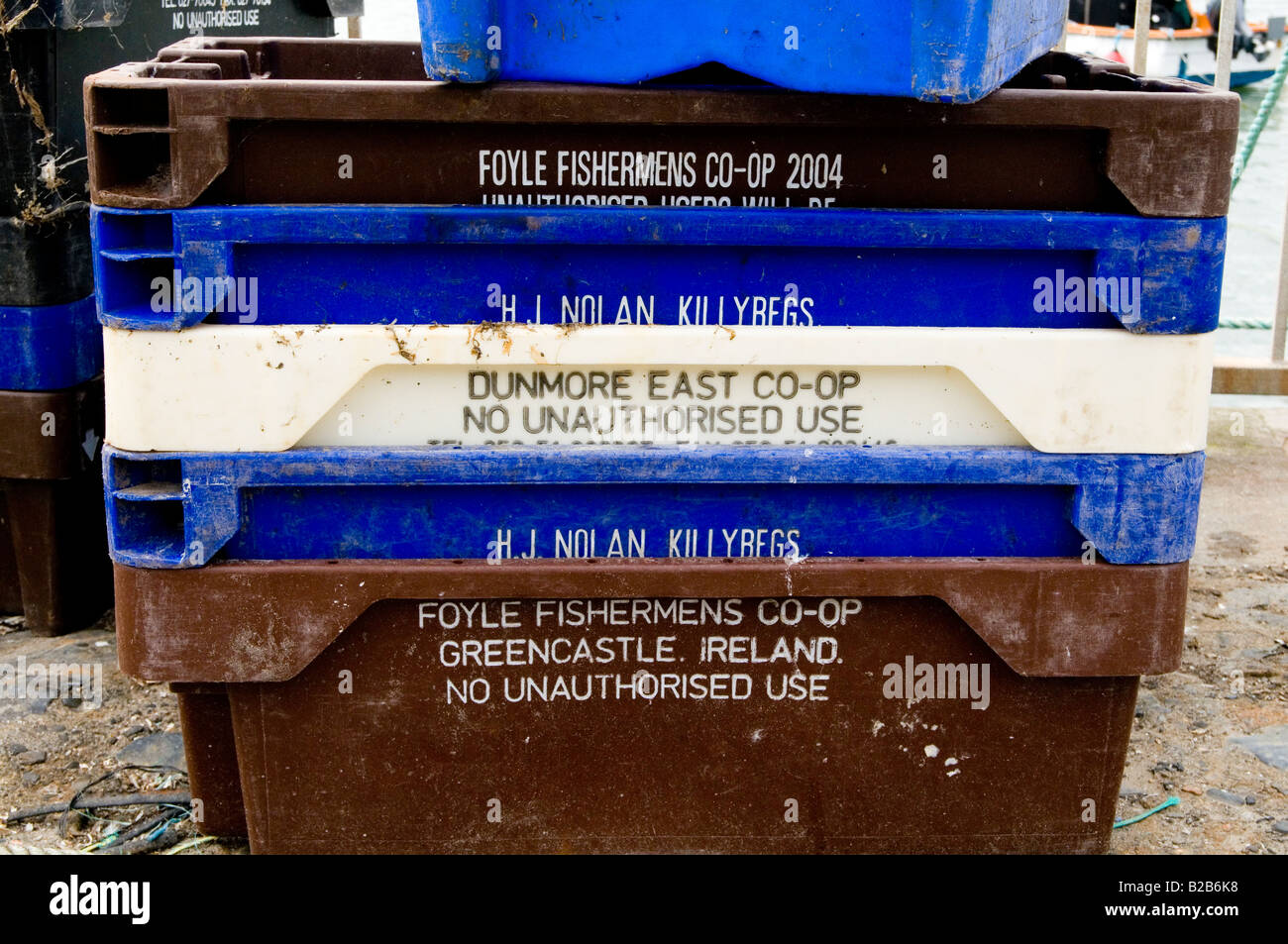 Fish boxes on the pier at Loughshinny harbour, north county Dublin ...