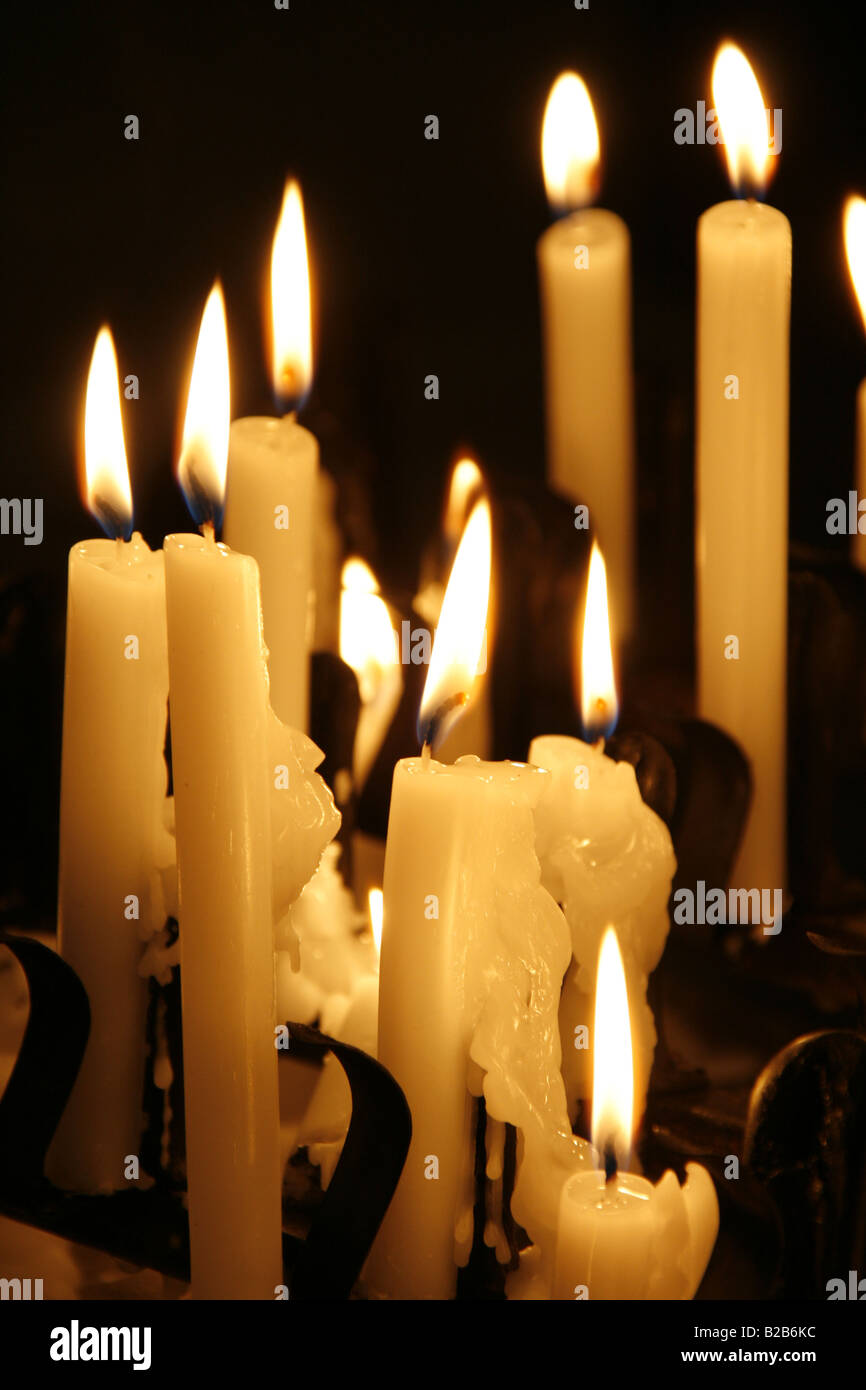 many lit candles in dark room in church Stock Photo - Alamy