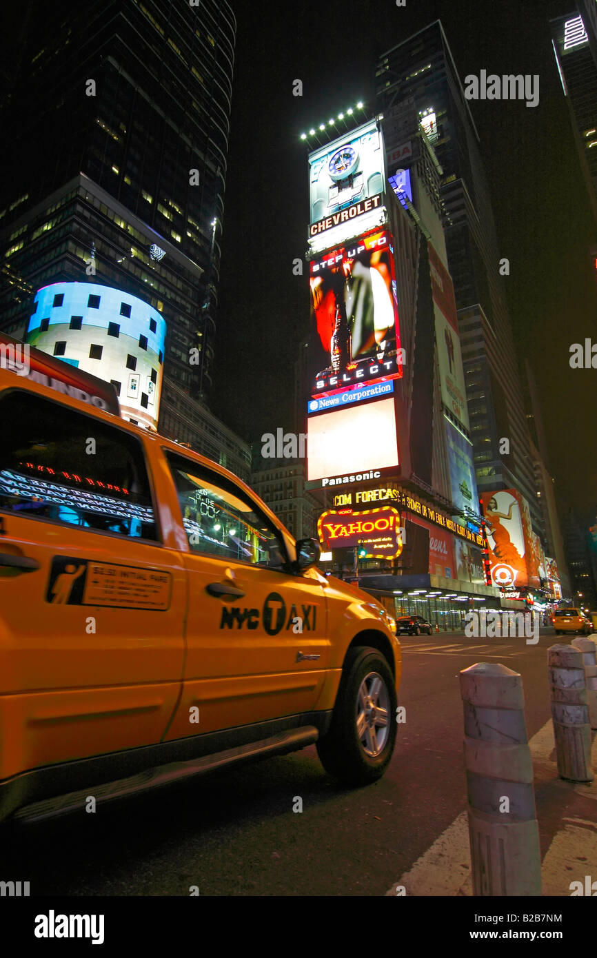 Yellow taxi cab at night in Times Square - New York City, USA Stock ...
