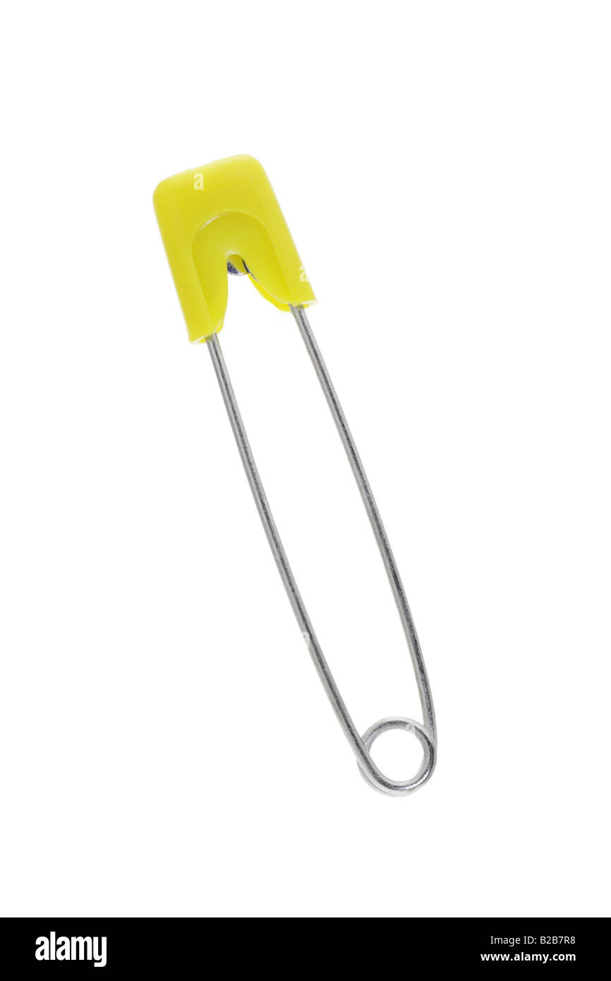 Safety pin in yellow on white background Stock Photo - Alamy