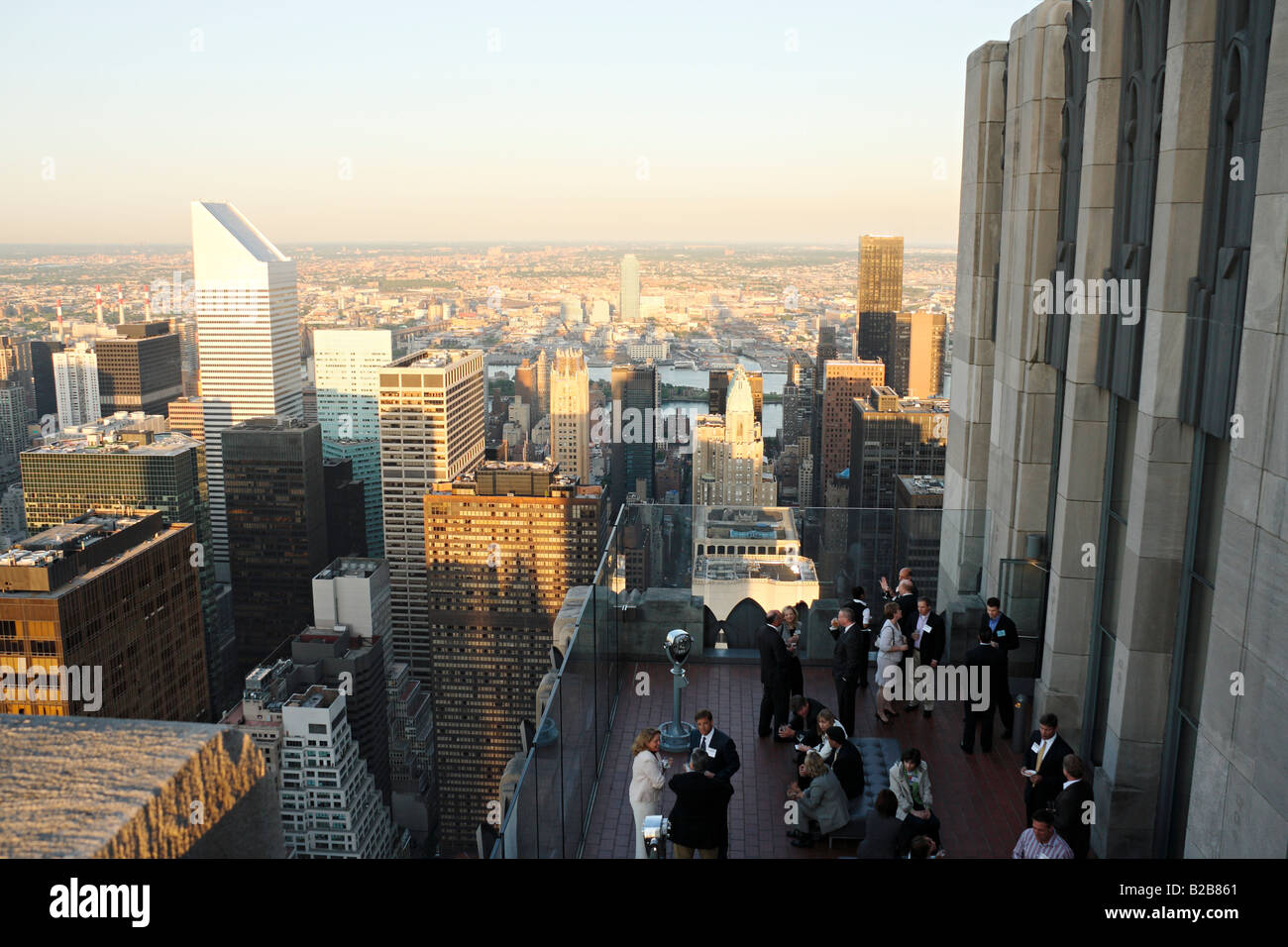 Coktail party at dusk on top of the Rockefeller Center - New York City ...