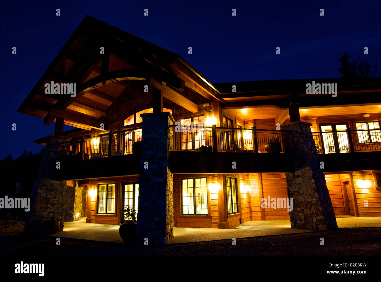 Night shot of a custom built building lit up Stock Photo - Alamy