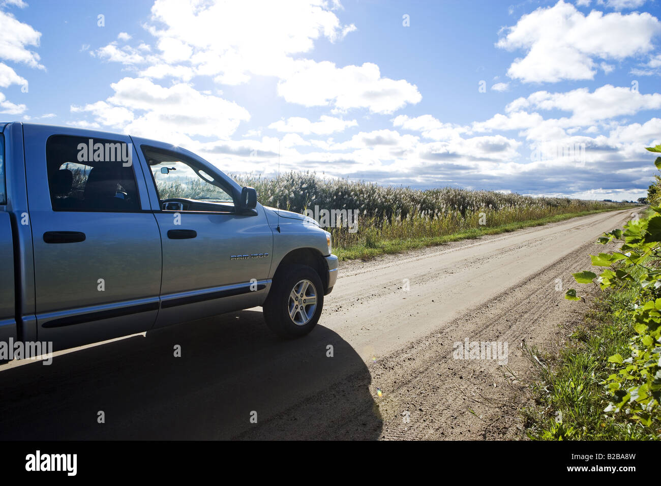 Dodge Ram driving down rural road Stock Photo - Alamy
