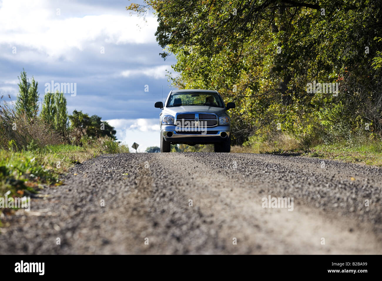 Dodge Ram driving down rural road Stock Photo - Alamy