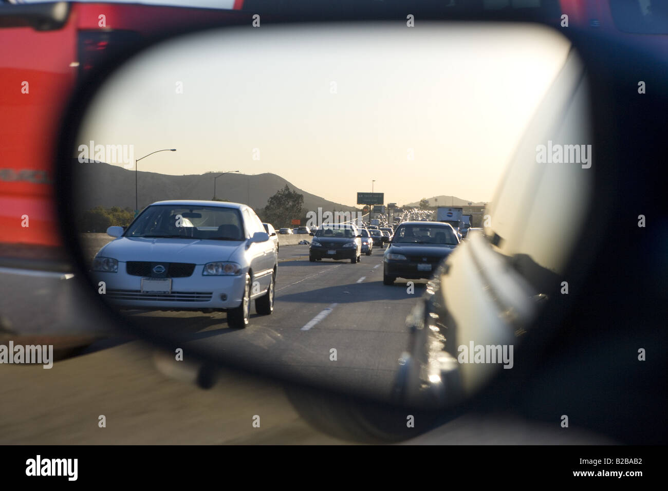 Freeway traffic as seen in side mirror Stock Photo - Alamy