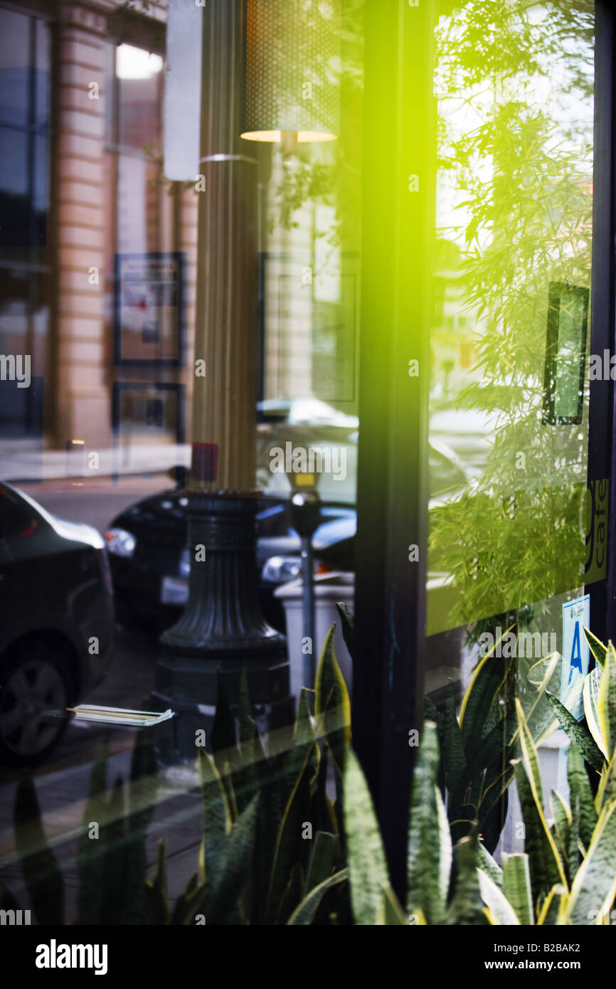Reflection of parked cars through window Stock Photo - Alamy