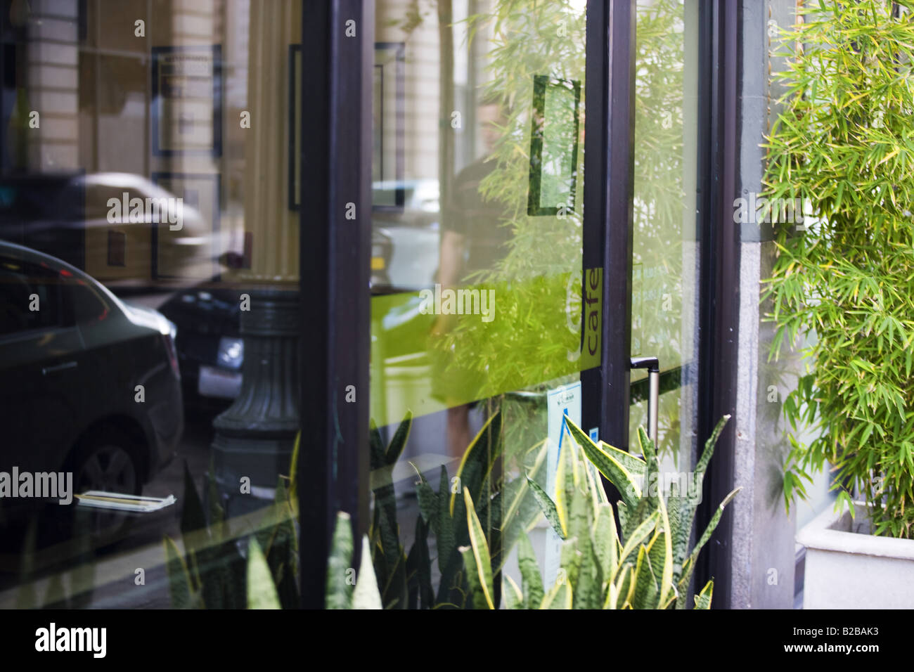 Reflection of parked cars through window Stock Photo - Alamy
