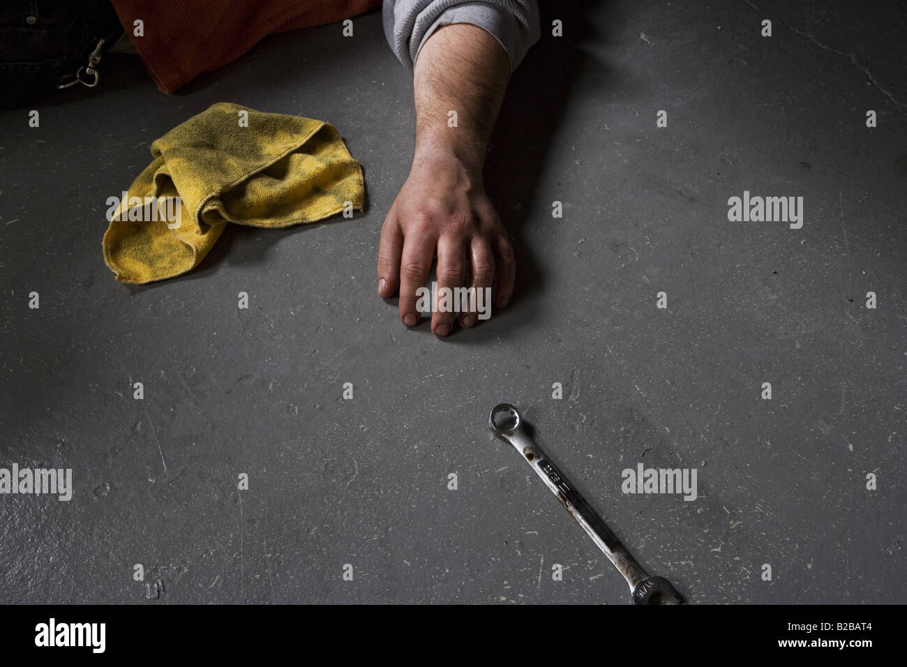 Auto mechanic underneath car Stock Photo - Alamy