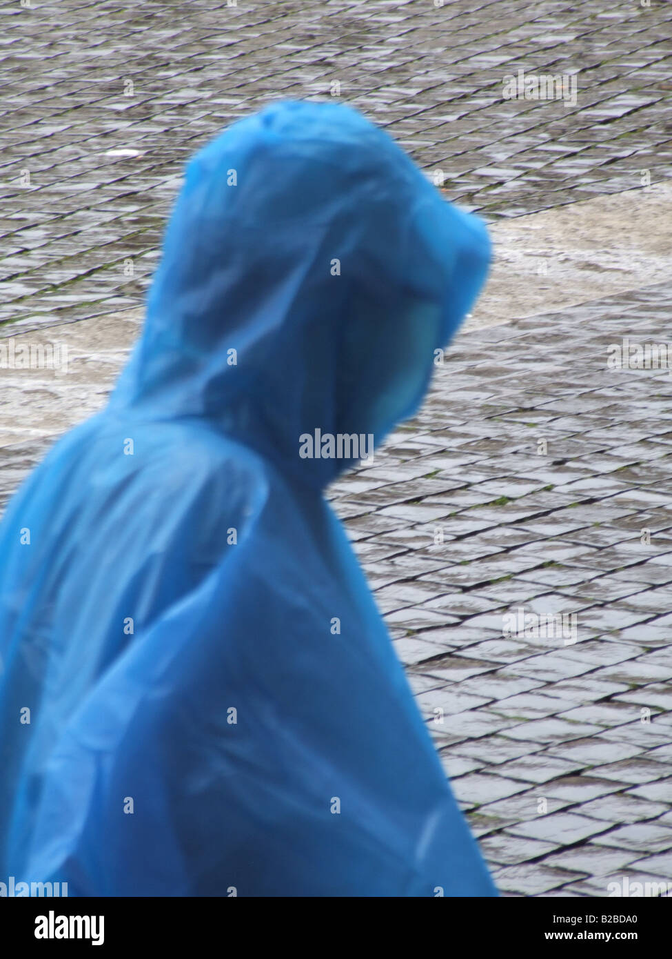 person wearing waterproof coat cape in rain Stock Photo - Alamy