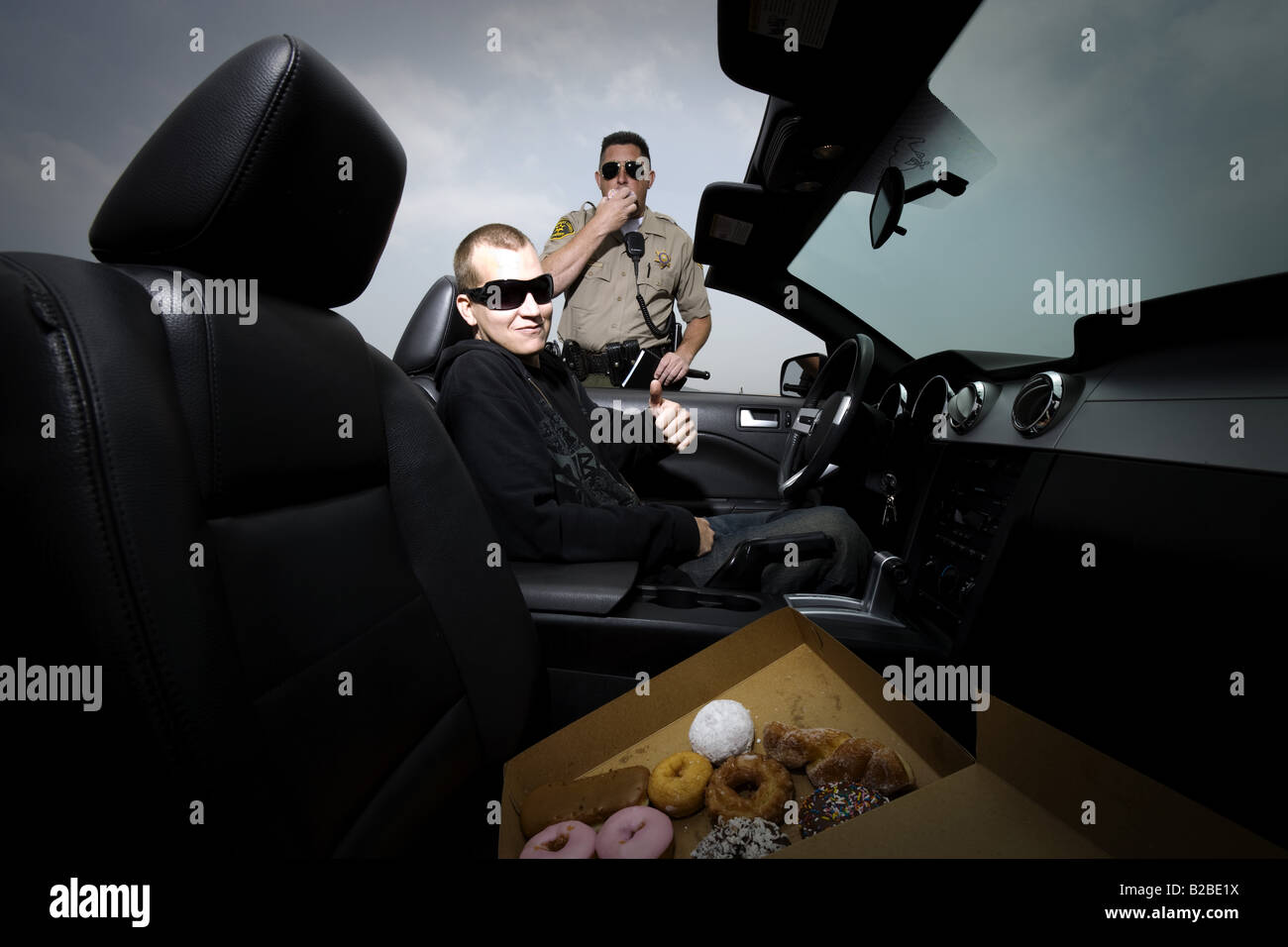 Police eating donut hi-res stock photography and images - Alamy