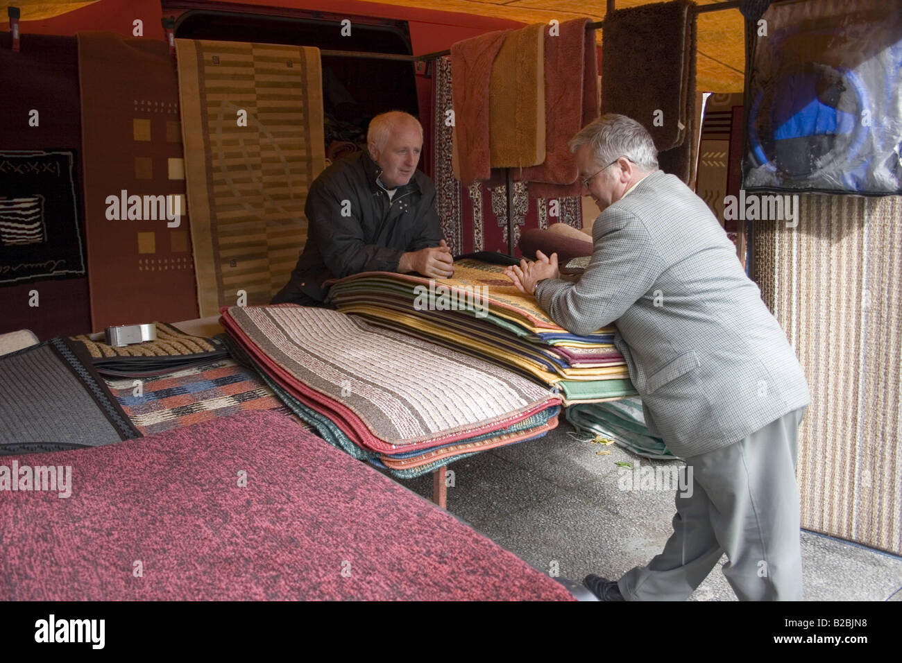 Men at carpet stall Ireland Date Stock Photo - Alamy