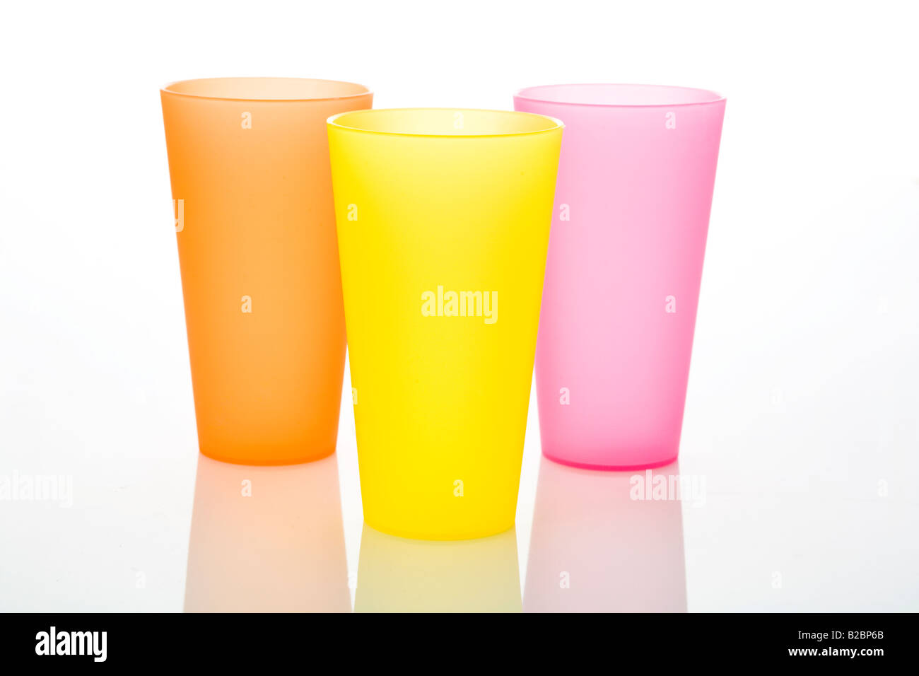 Grouping of three colorful plastic cups on white background Stock Photo ...