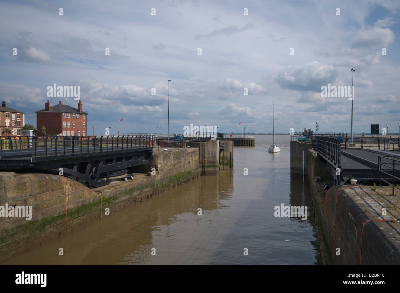 A yacht coming into the Marina at Hull through the Humber Dock with the ...